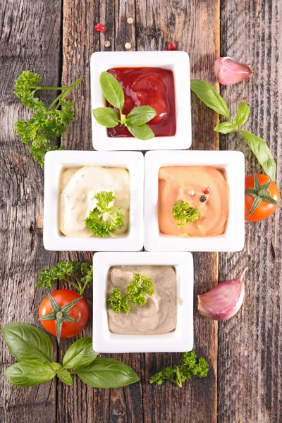 Assorted sauces in bowls — Stock Photo © studioM #106587358