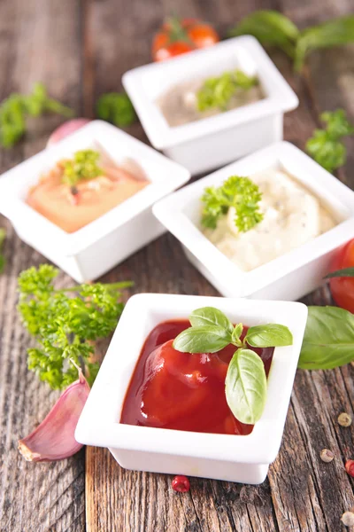 Assorted sauces in bowls — Stock Photo © studioM #106587358