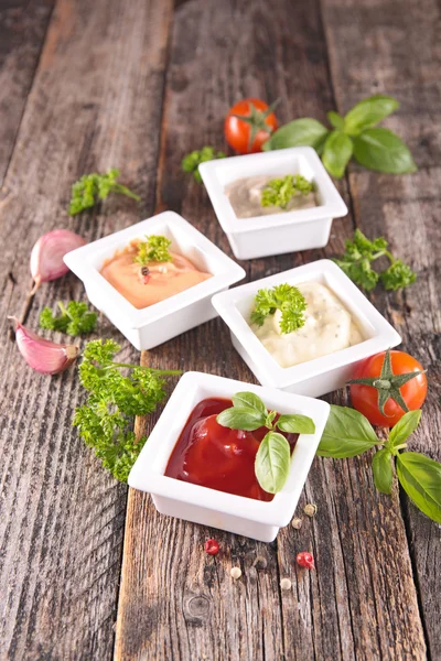 Assorted sauces in bowls — Stock Photo © studioM #106587358