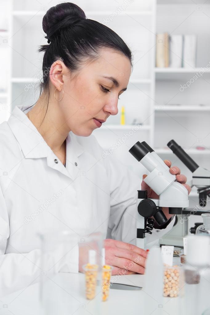 Laboratory assistant in the laboratory of of food quality.Cell culture ...