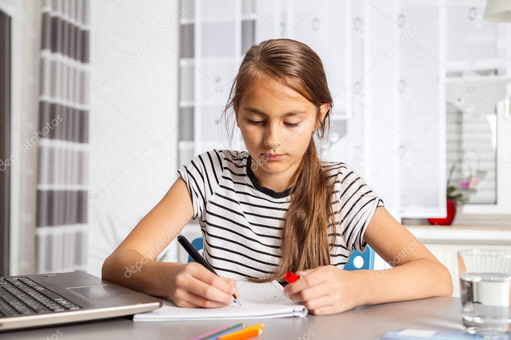 Beautiful girl working on her school project at home. — Stock Photo ...