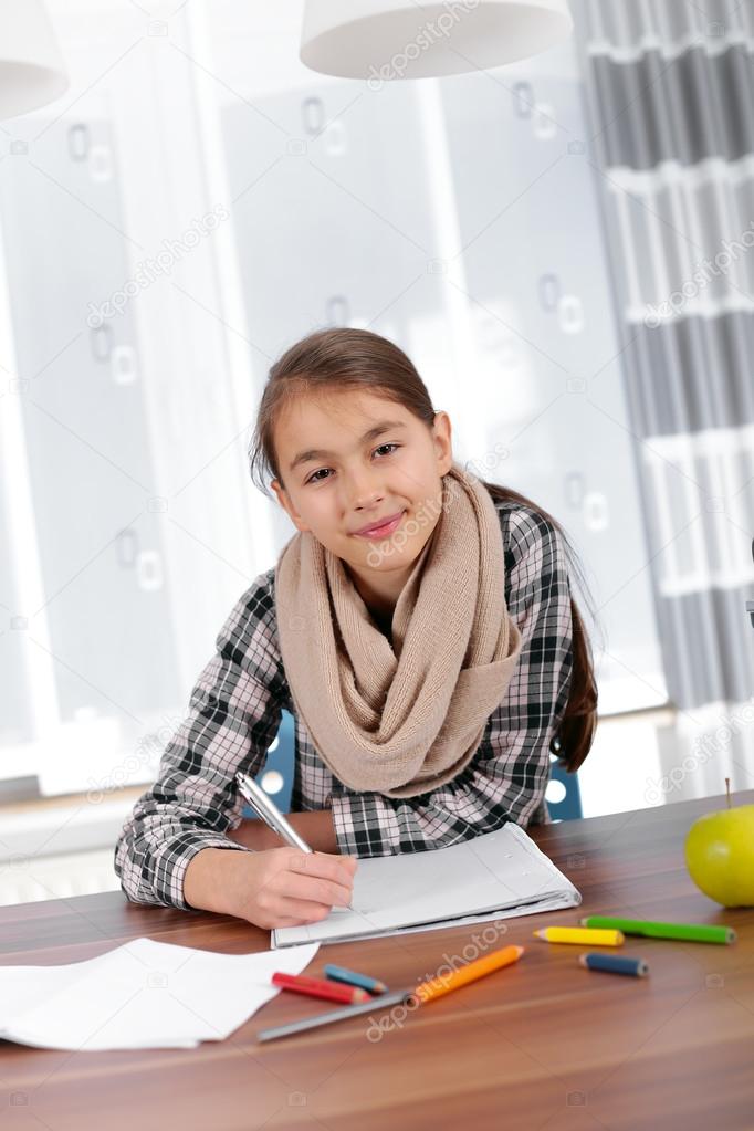 Little girl working on her school project at home. — Stock Photo ...