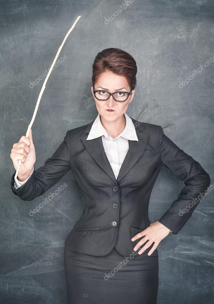 Angry teacher with wooden stick Stock Photo by ©DarkBird 110314700