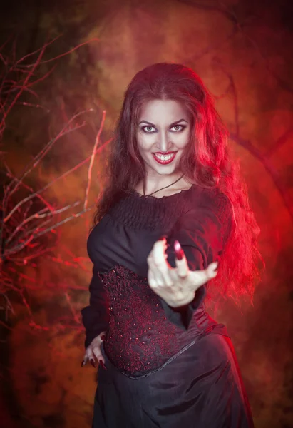 Beautiful witch on Halloween background Stock Photo by ©DarkBird 84406322