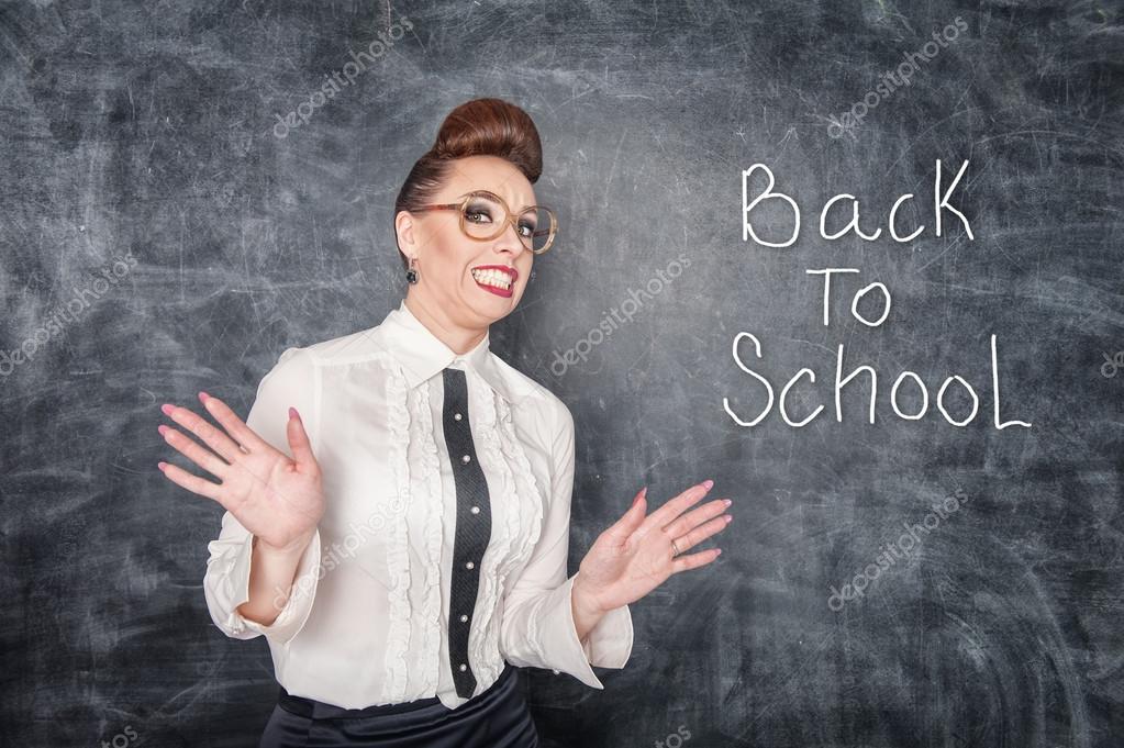 Scared teacher in the eyeglasses Stock Photo by ©DarkBird 52168575