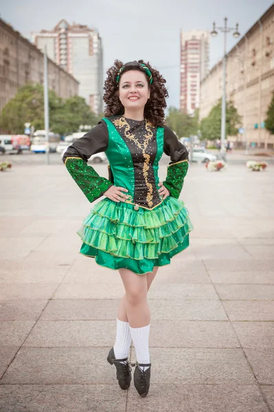 Young woman in irish dance dress and wig posing - Stock Image - Everypixel