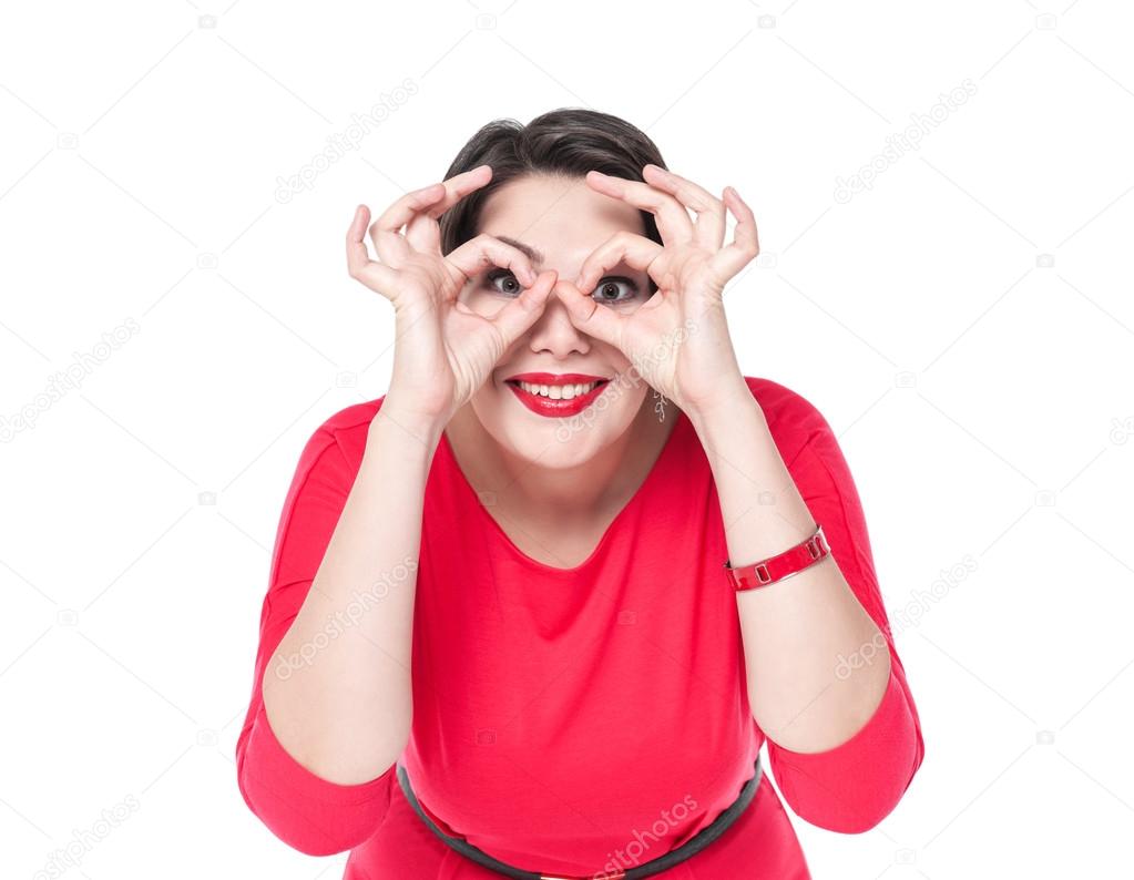 Beautiful plus size woman gesturing glasses with her hands Stock Photo ...