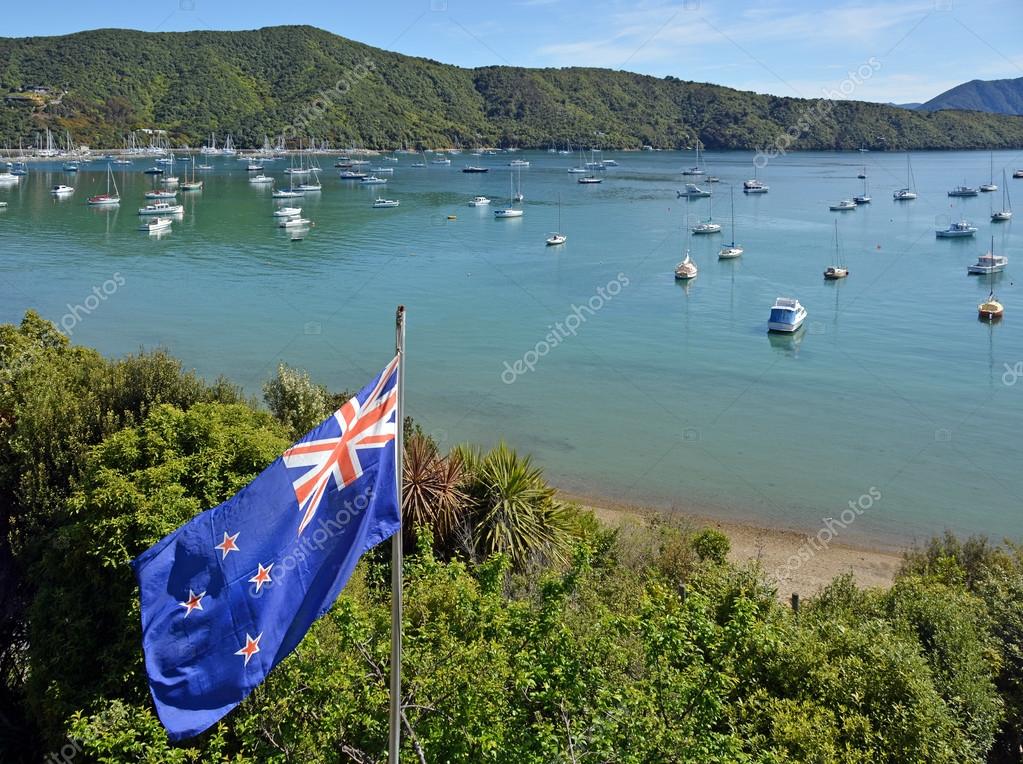 New Zealand Flag Proudly Fluttering in Marlborough Sounds — Stock Photo ... New Zealand Flag Proudly Fluttering in Marlborough Sounds — Stock Photo ...