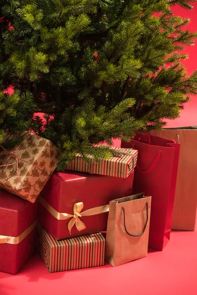 Beautiful christmas tree with gift boxes and shopping bags Stock Photo ...