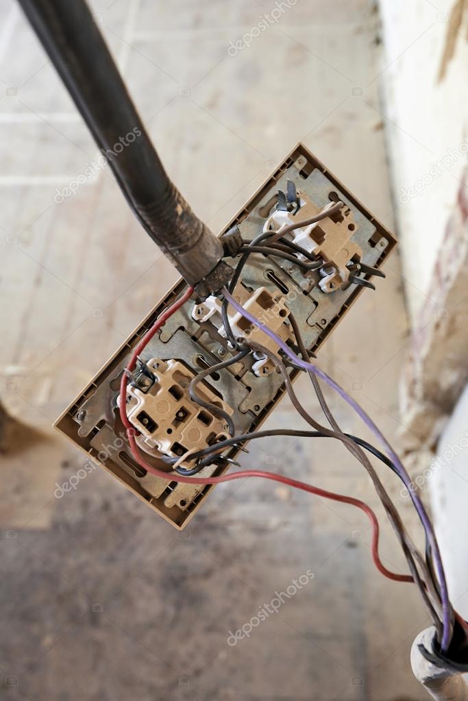 Light switch and electrical outlet — Stock Photo © Bombaert #78385802