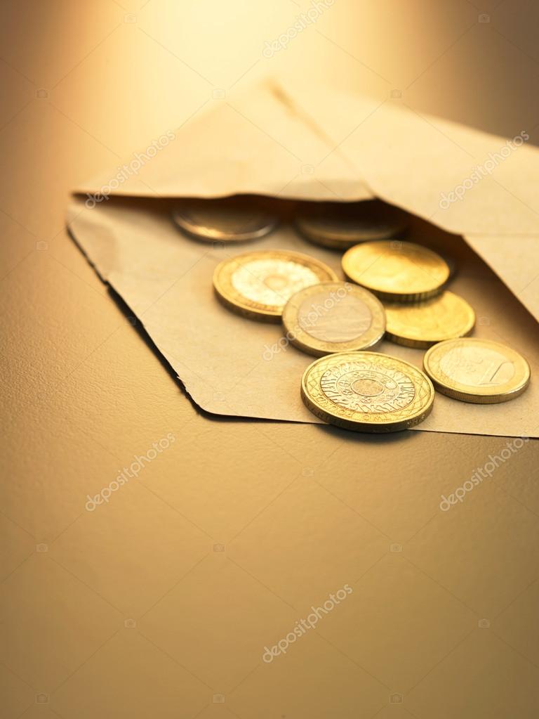 Coins from the brown envelope Stock Photo by ©eskaylim 68918707