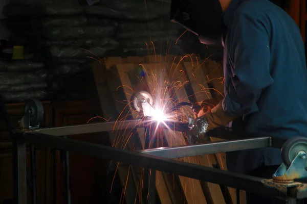 Welding. A welder Arc Welds metal together. Industrial Welding. - Stock ...