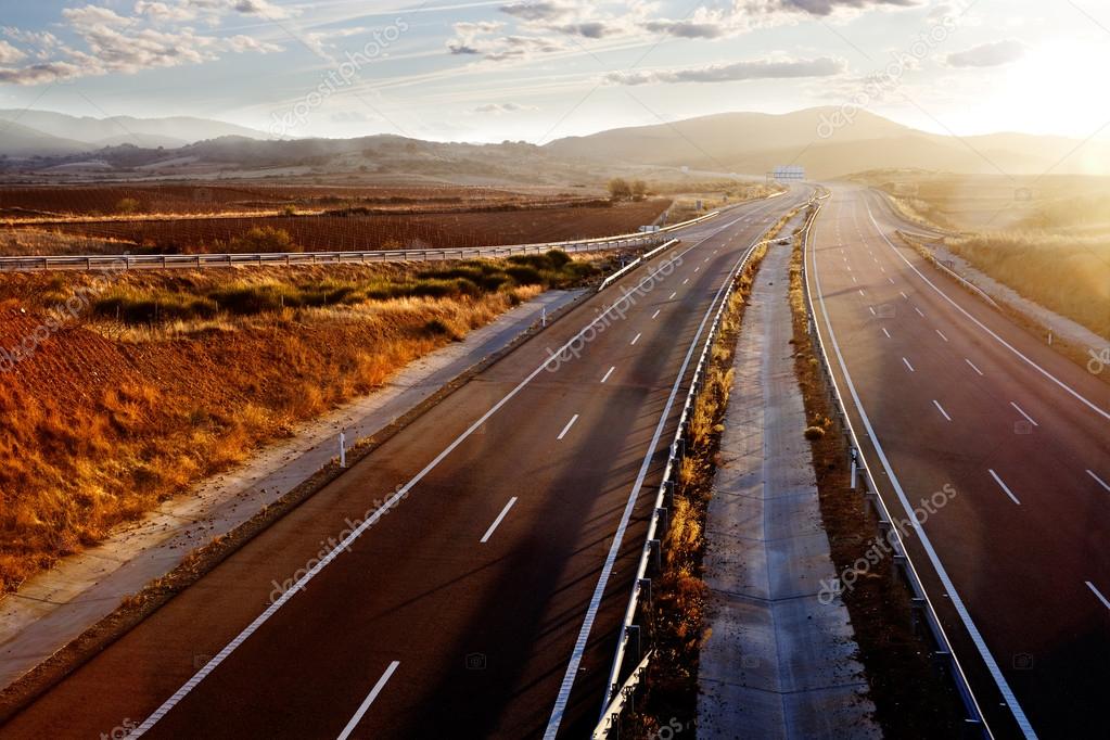 Sunset and road landscape — Stock Photo © carloscastilla #73365983