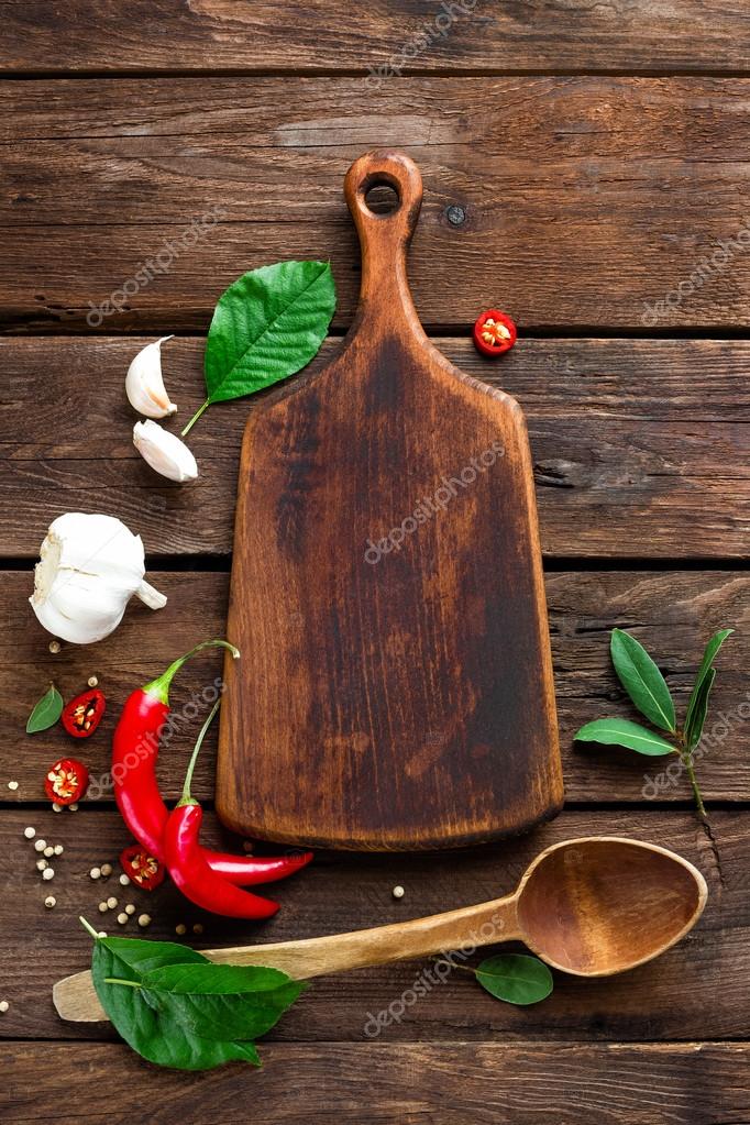 Dark culinary background with various herbs and spices, top view ...