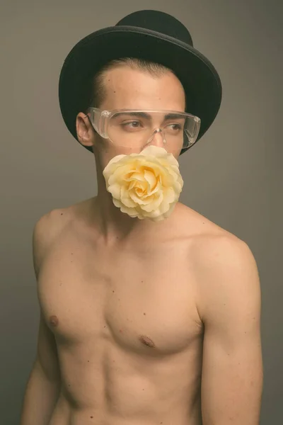 Man roses shirtless Stock Photos, Royalty Free Man roses shirtless ...