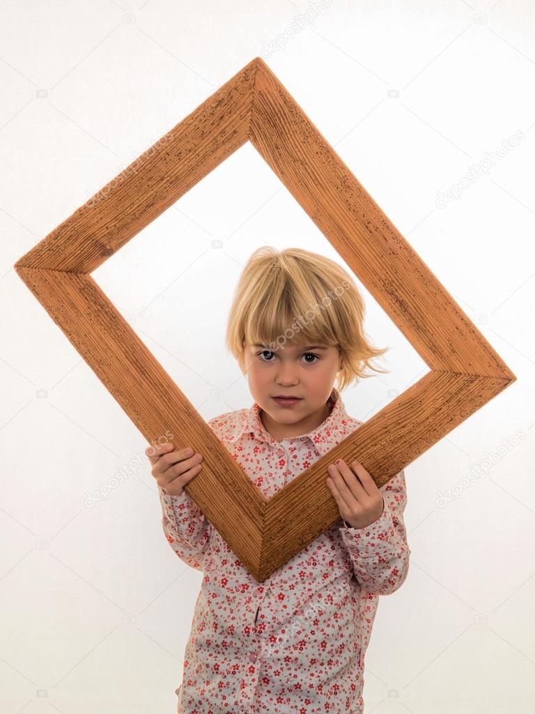 Child looking through a frame — Stock Photo © ginasanders #101775558