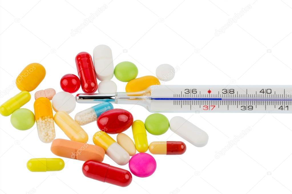 Fever thermometer and tablets Stock Photo by ©ginasanders 61500101