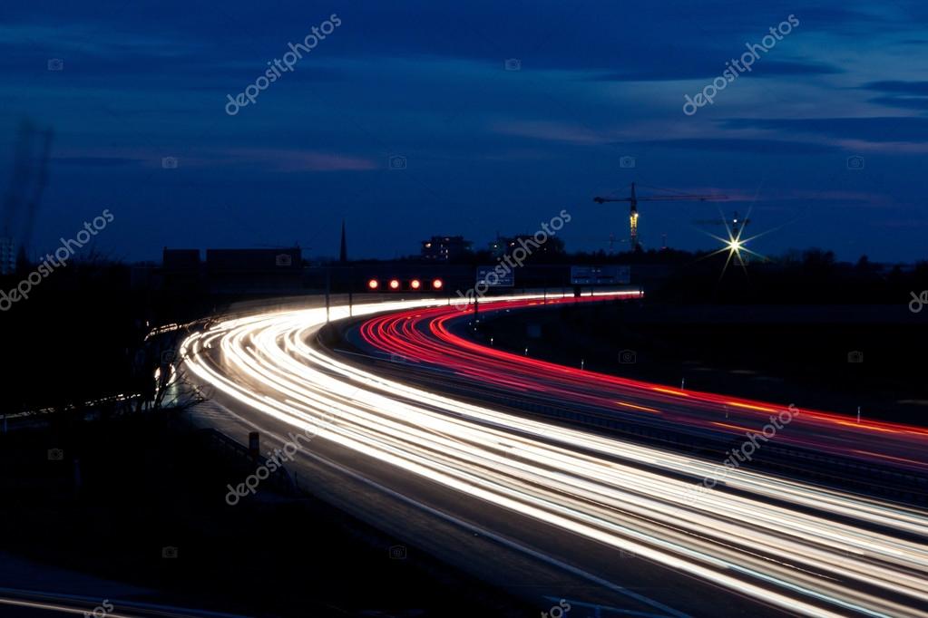 Cars on freeway at night — Stock Photo © ginasanders #61500391
