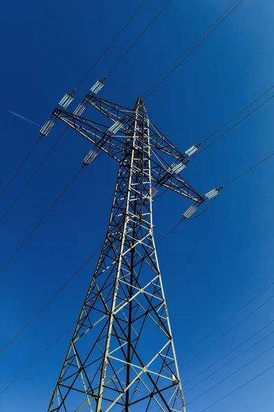 Electricity pylon against the light — Stock Photo © ginasanders #39263923