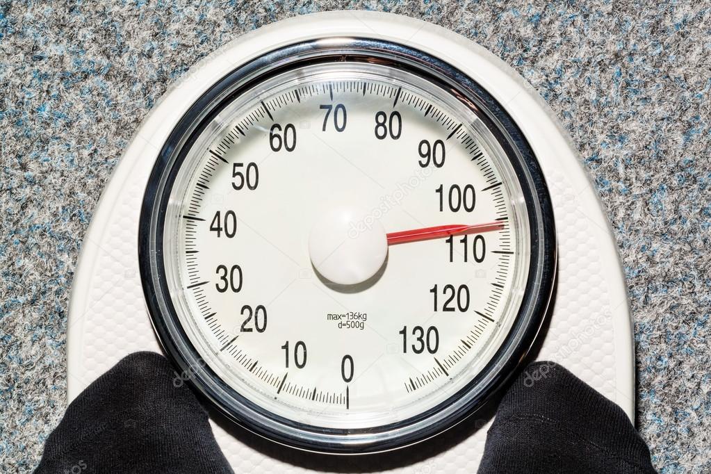 Overweight on scales Stock Photo by ©ginasanders 82668696
