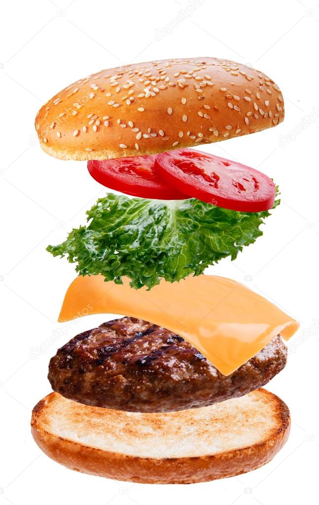Delicious burger with flying falling ingredients on white background ...