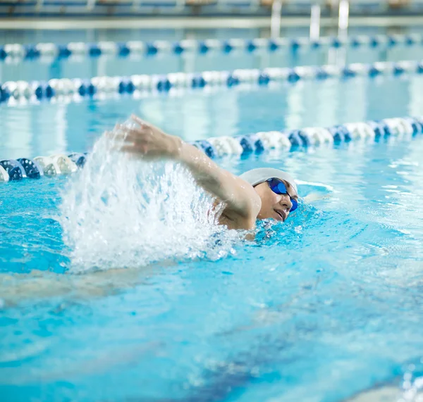Girl swimming front crawl stroke style Stock Photo by ©markin 52924549