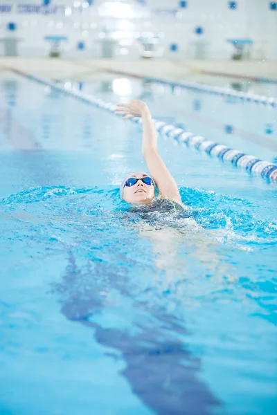 Girl swimming back crawl stroke style Stock Photo by ©markin 37223409