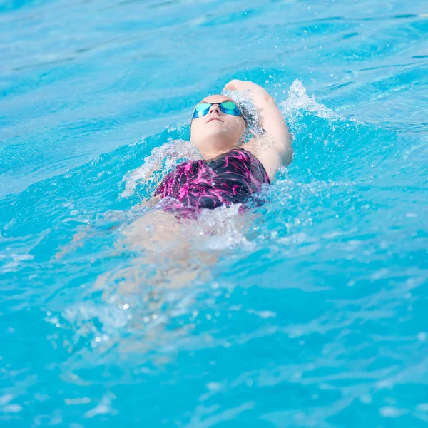 Woman swimming back crawl style - Stock Image - Everypixel
