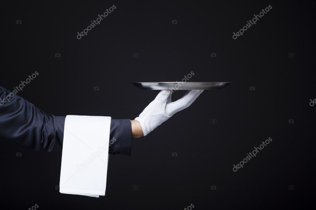 Waiter hand holding a tray Stock Photo by ©cristovao 72367651