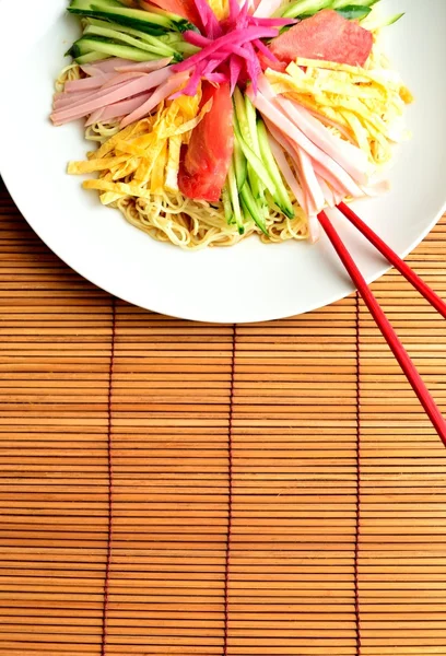 Chilled ramen noodles "Hiyashi chuuka" with red chopsticks - Stock ...