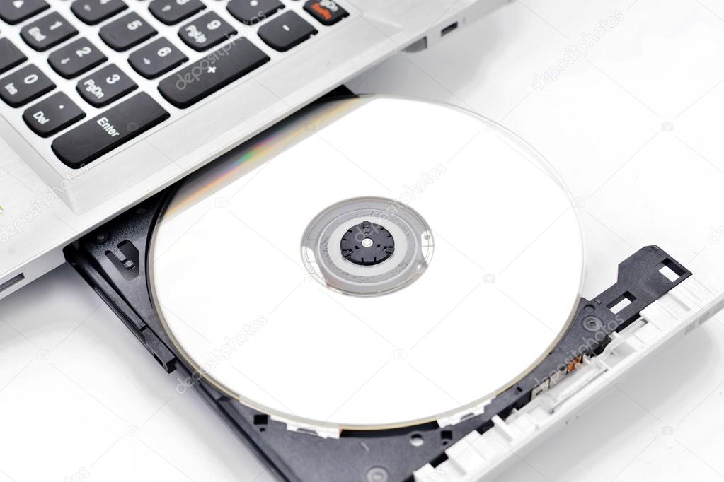 Laptop with the blank disk — Stock Photo © bigjom #89765062