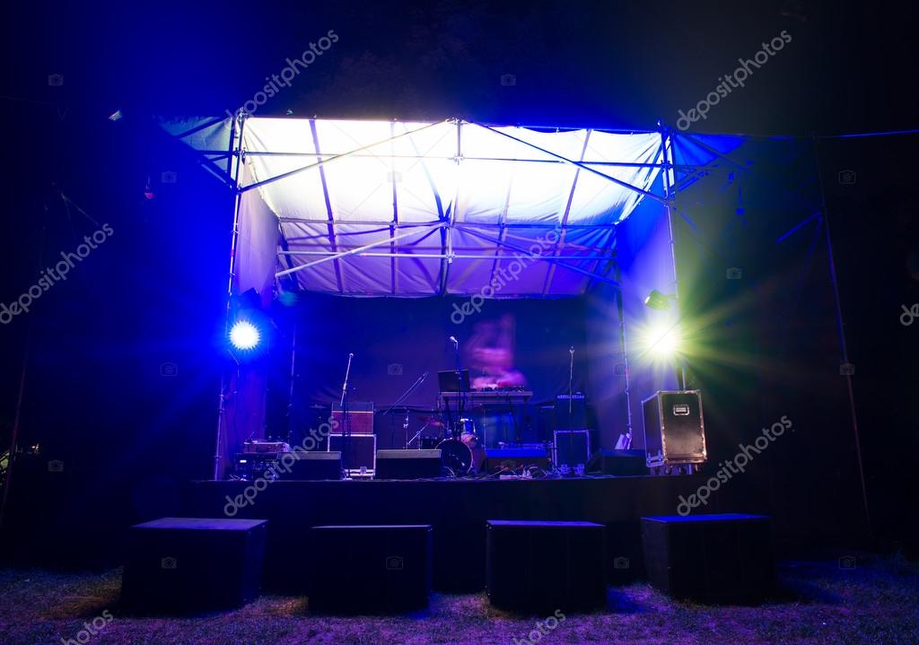 DJ on a small stage Stock Photo by ©badahos 66311487