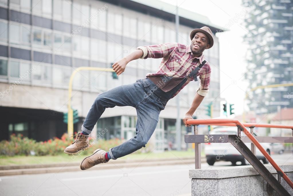 Afro black man jumping Stock Photo by ©peus 109844314