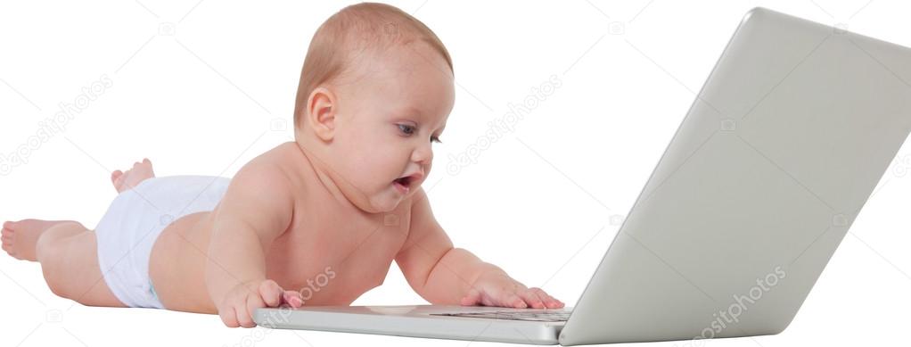 Curious cute baby boy using laptop Stock Photo by ©Ambrophoto 113677478