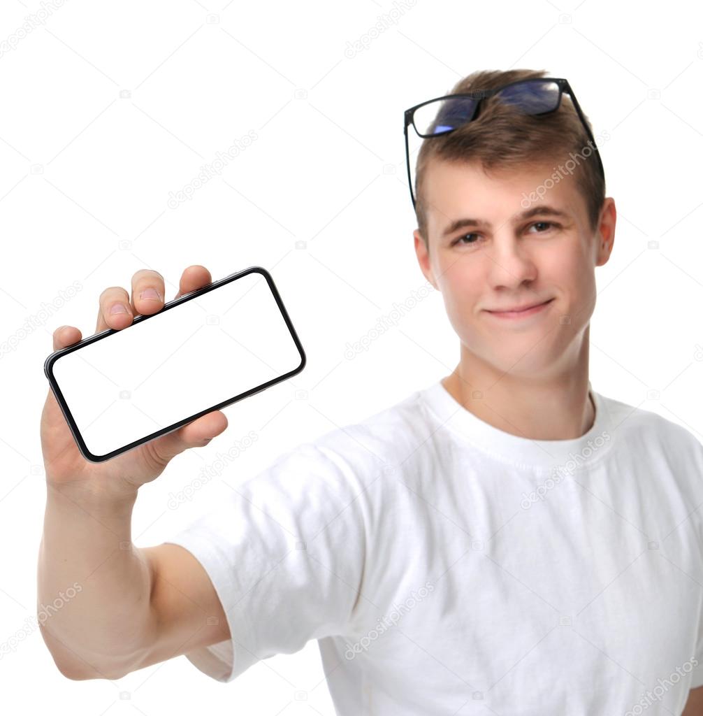 Happy young man show display of mobile cell phone with blank scr ...