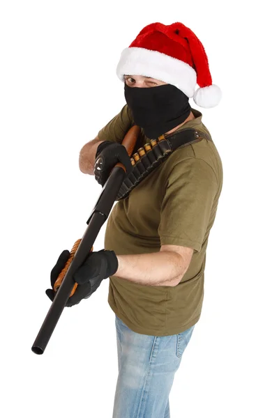 Robber in cap of Santa Claus with shotgun Stock Photo by ©zim90 80424662