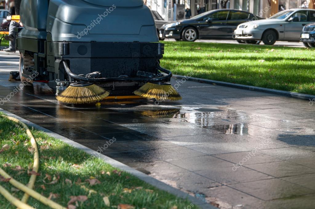 Process of cleaning walkways — Stock Photo © Tanchic #66385081