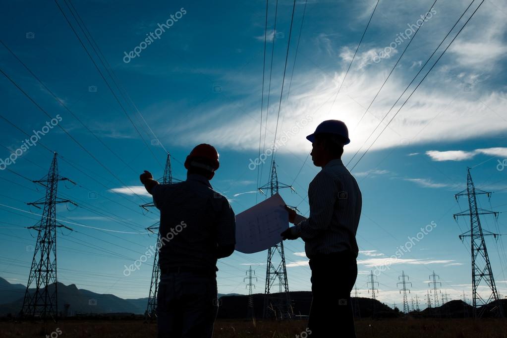 Workers at electricity station — Stock Photo © shotsstudio #54884909