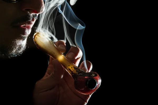 Smoking marijuana — Stock Photo © wollertz #55123517