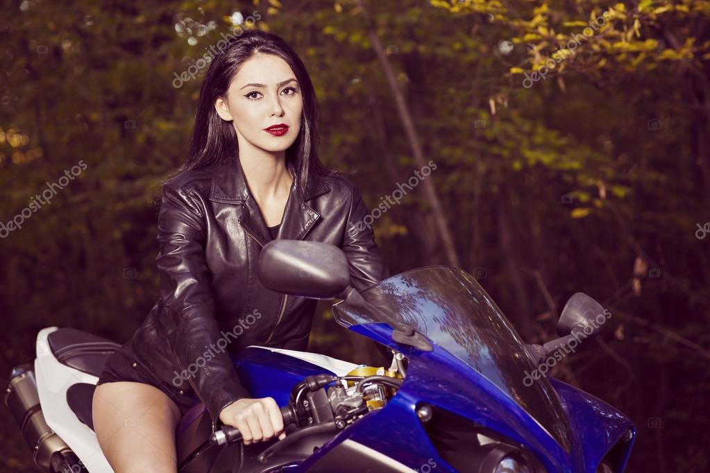 Beautiful Biker girl on a motorcycle — Stock Photo © czamfir #89002140