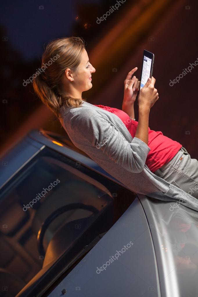 Female driver using her tablet computer Stock Photo by ©lightpoet 67800955