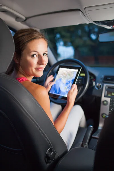 Female driver using her tablet computer Stock Photo by ©lightpoet 67800975