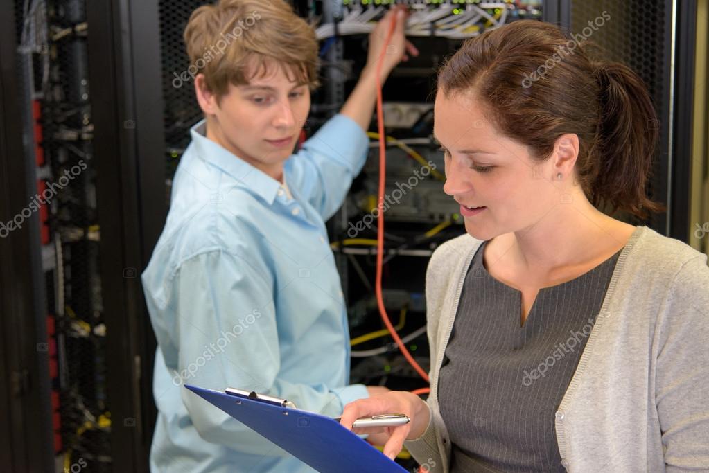 Team of IT technicians in server room — Stock Photo © CandyBoxImages ...