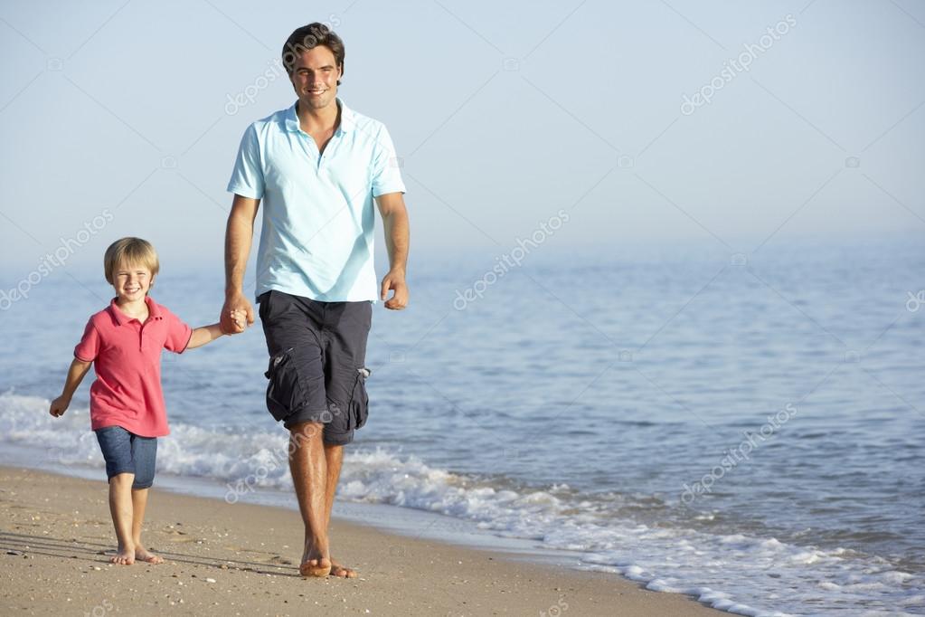 Father And Son Walking on Beach Stock Photo by ©monkeybusiness 102679702