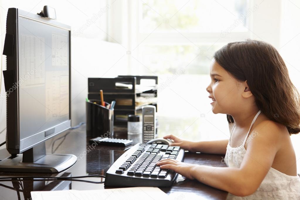 Young girl using computer at home Stock Photo by ©monkeybusiness 102714496