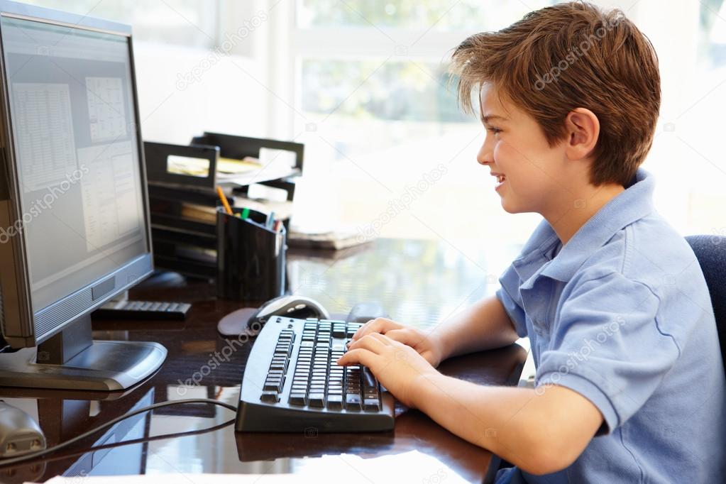 Young boy using computer Stock Photo by ©monkeybusiness 102721896