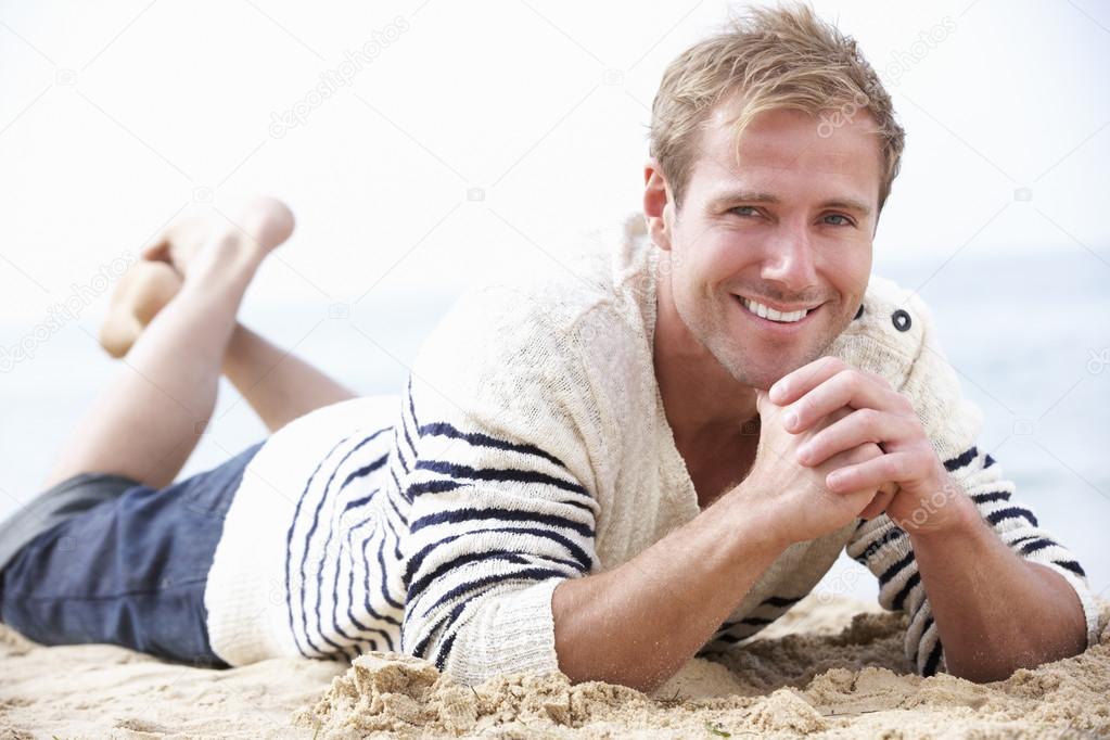 Man Relaxing On Beach — Stock Photo © monkeybusiness #102777156