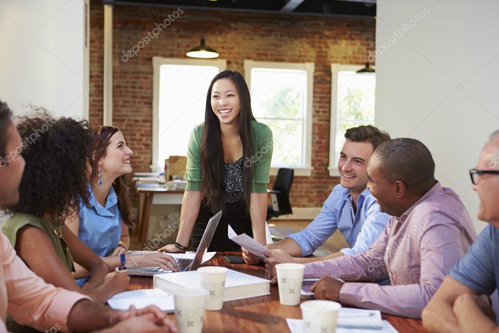 Boss Addressing Office Workers At Meeting Stock Photo by ...