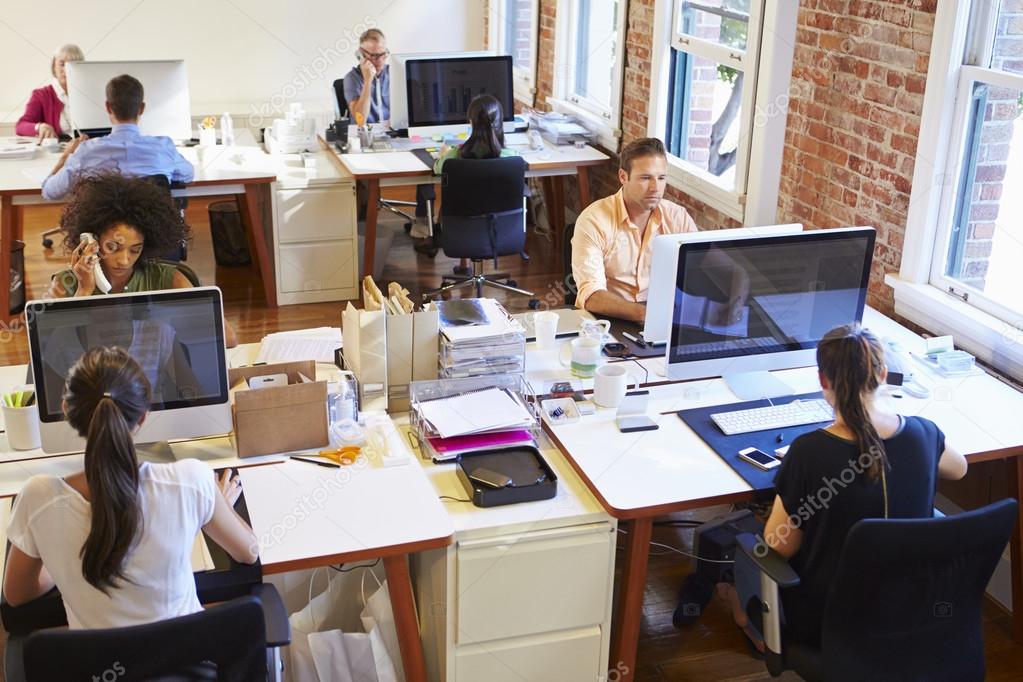 Busy Design Office With Workers At Desks — Stock Photo © monkeybusiness ...