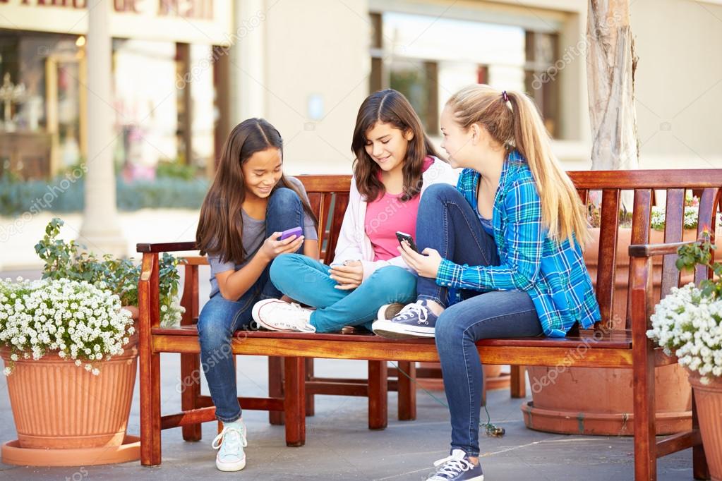 Girls Using Mobile Phones — Stock Photo © monkeybusiness #102798358
